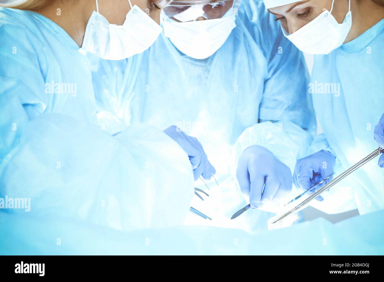 A group of surgeons is operating at the hospital. Health care concept ...