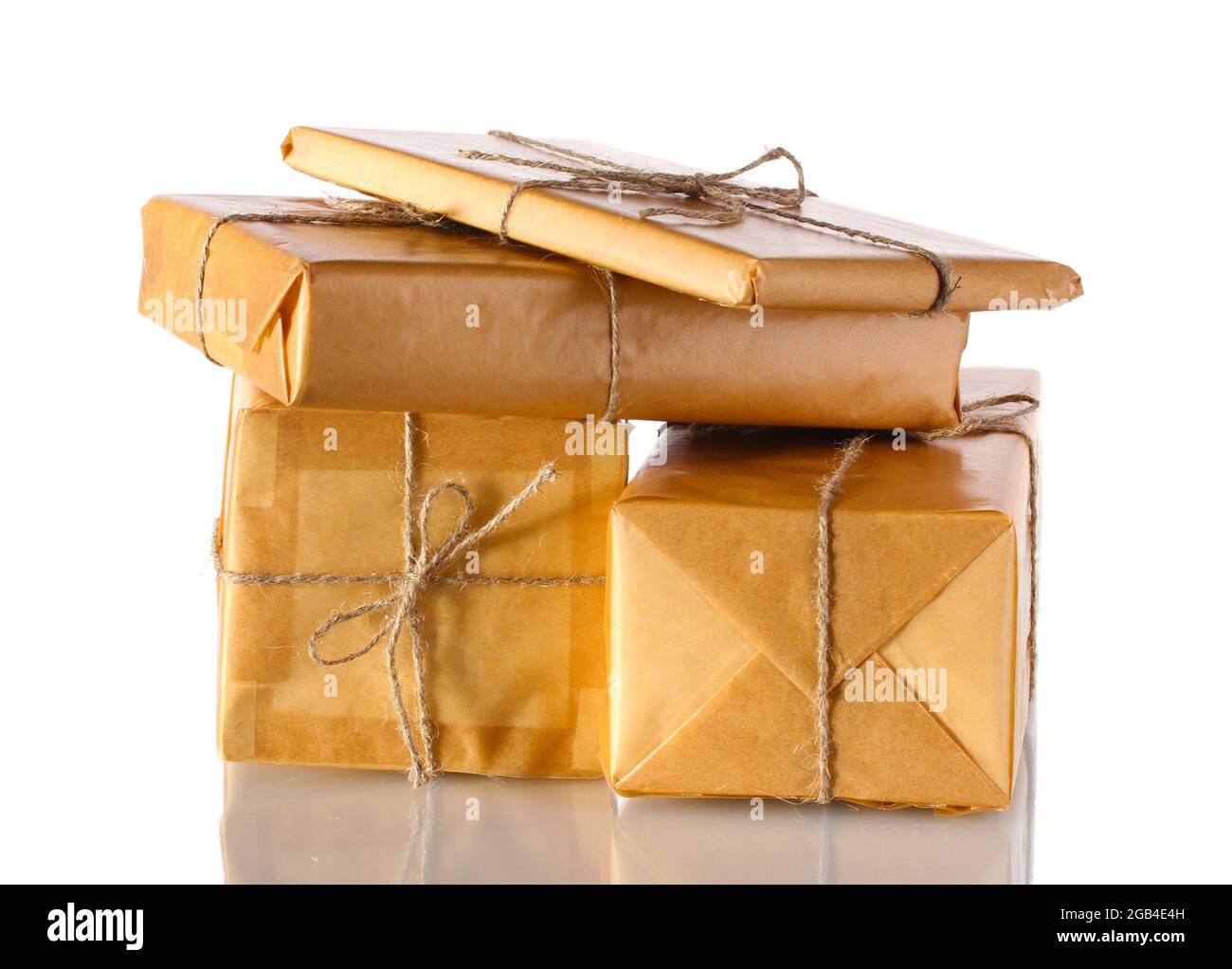 Many parcels wrapped in brown paper tied with twine isolated on white ...
