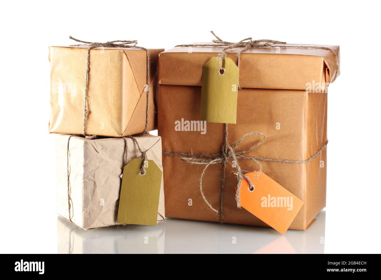 Many parcels wrapped in brown paper tied with twine and with blank ...