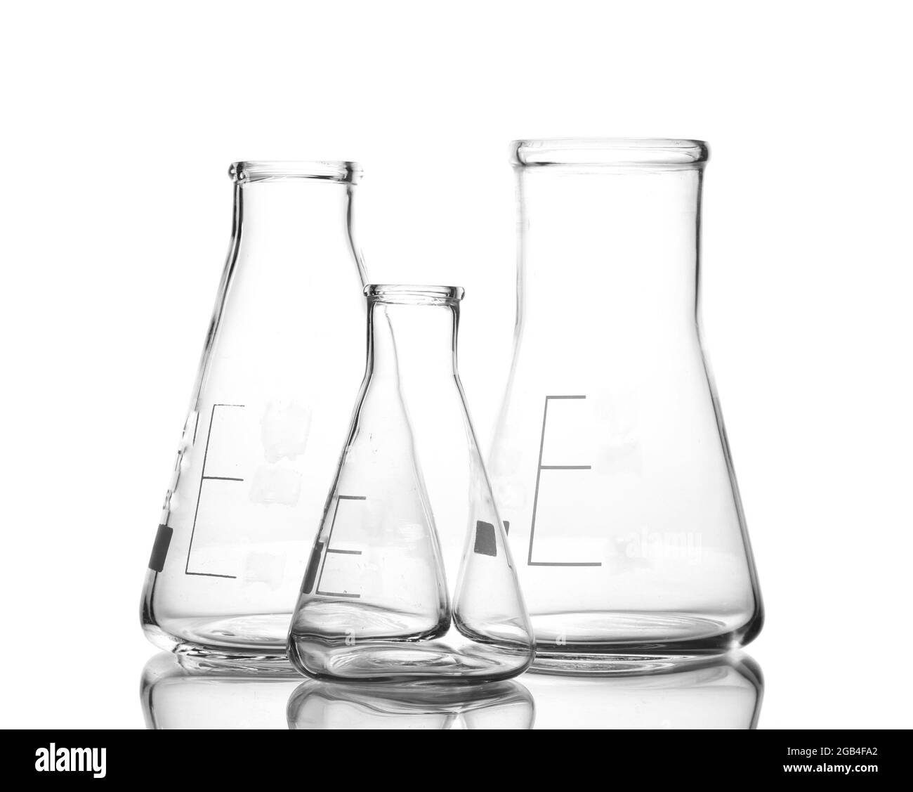 Three empty flasks with reflection isolated on white Stock Photo - Alamy