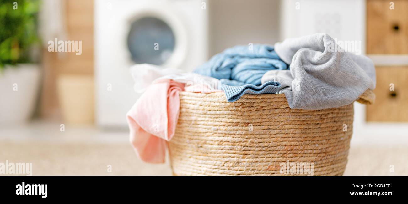 clothes in the basket in the laundry room Stock Photo - Alamy