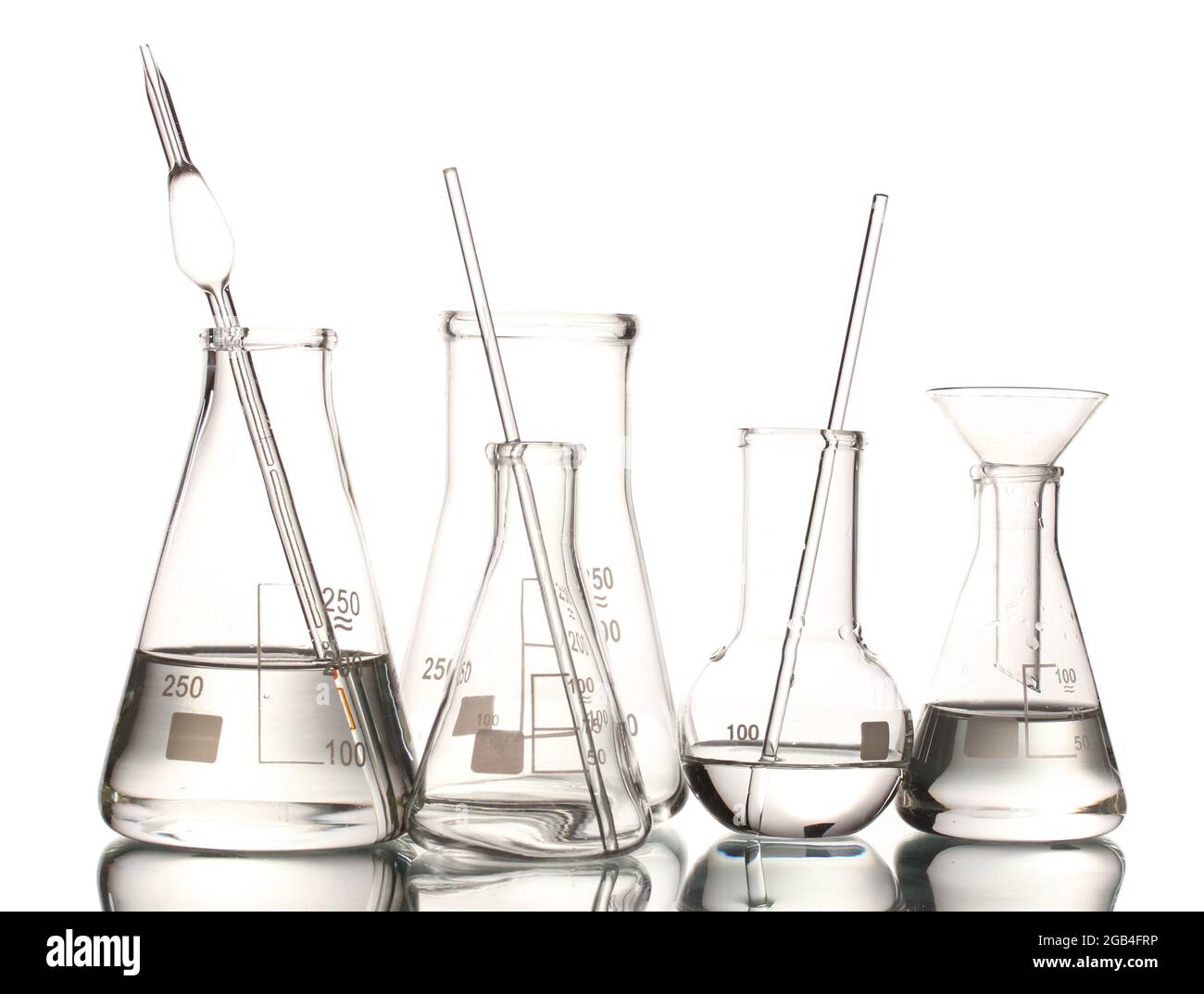 Different laboratory glassware with water and empty with reflection ...
