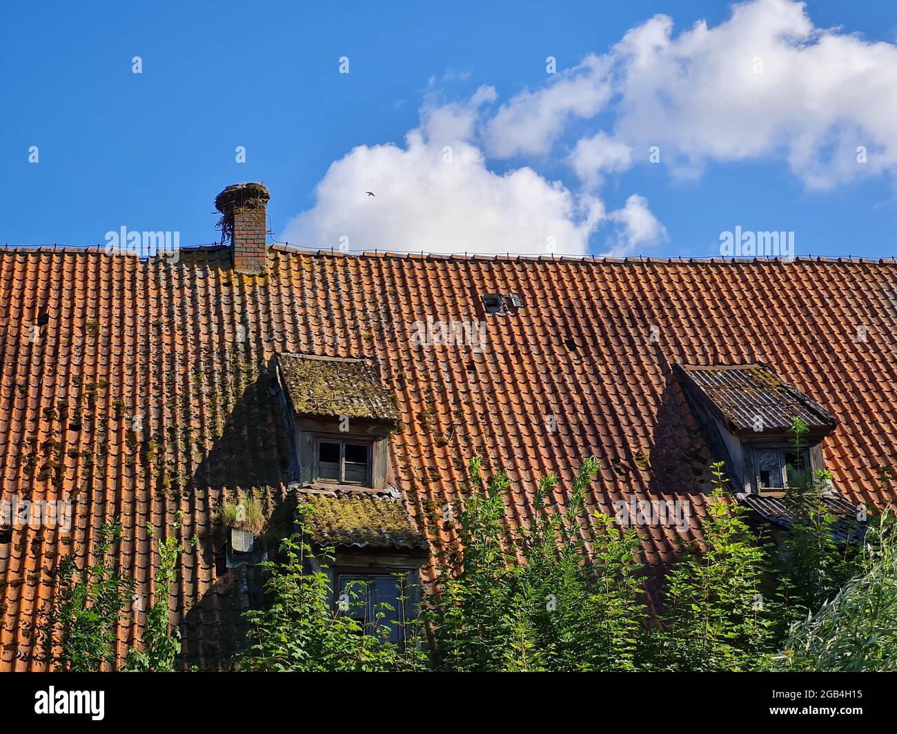 Old roof windows on abandoned house and blue sky with clouds Stock ...