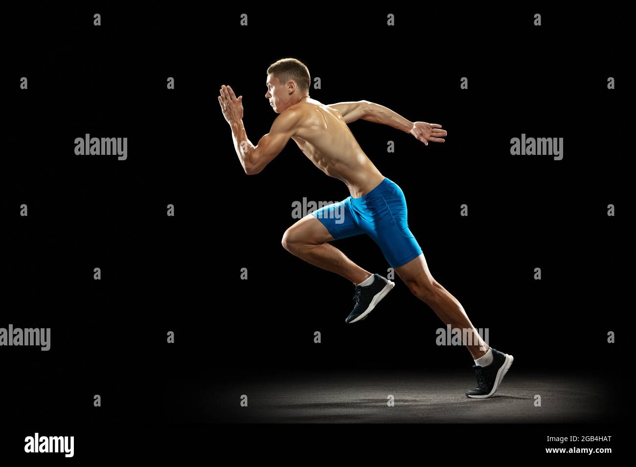 Leader, champion. Young professional male athlete, runner training ...