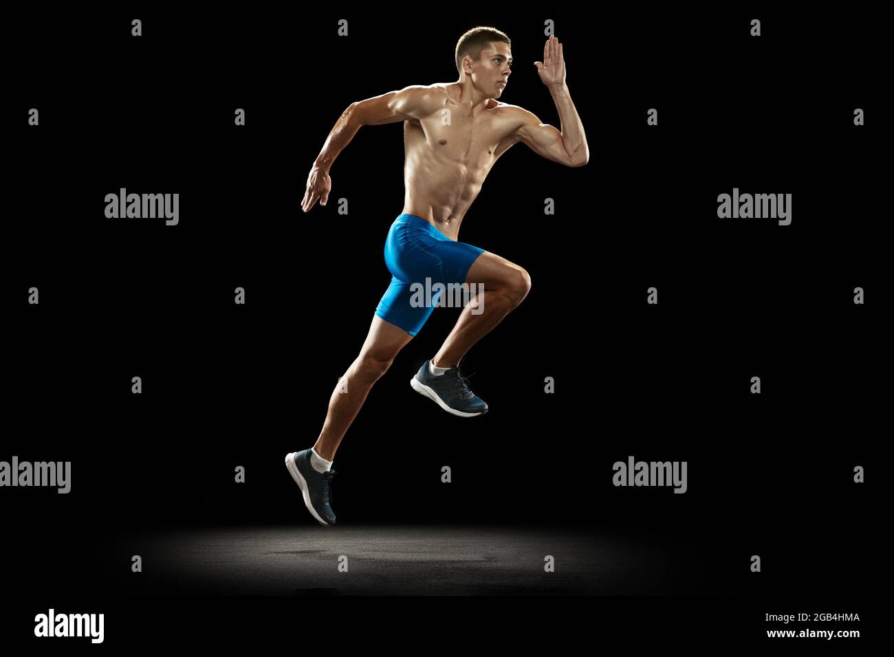 Leader, champion. Young professional male athlete, runner training ...