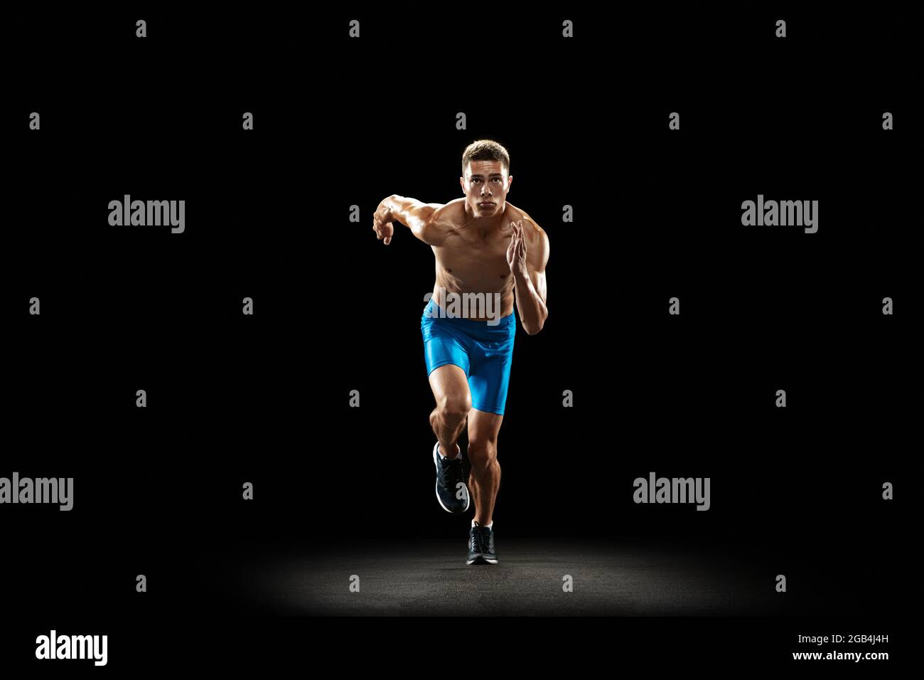 Portrait of Caucasian professional male athlete, runner training ...