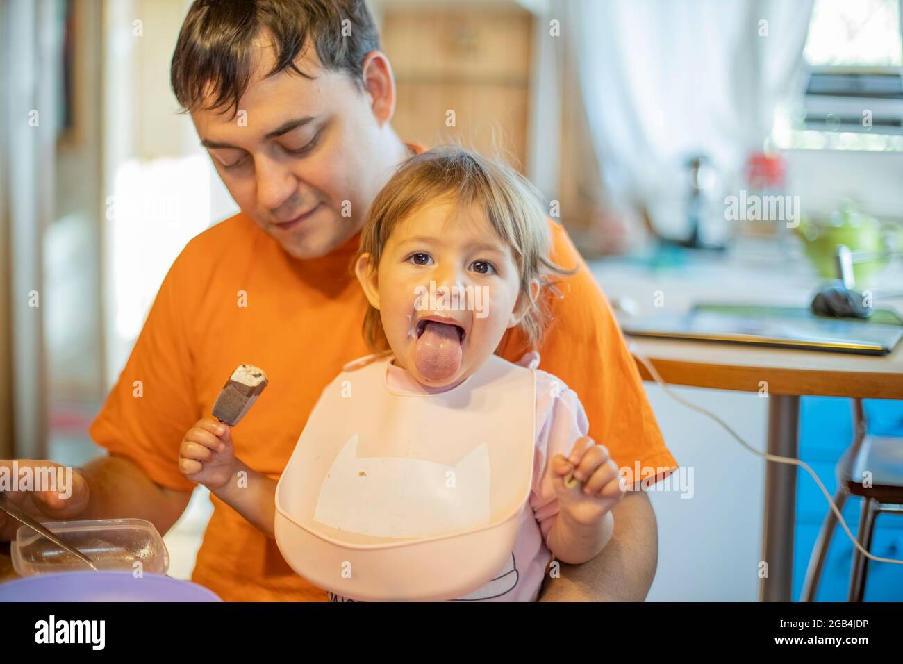 funny child eating ice cream adorable infant eating ice cream and shows ...