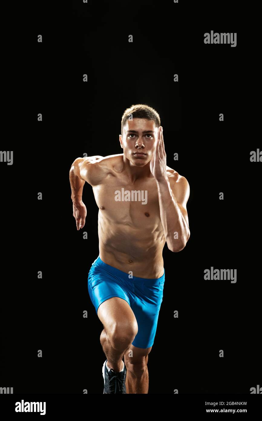 Portrait of Caucasian professional male athlete, runner training ...