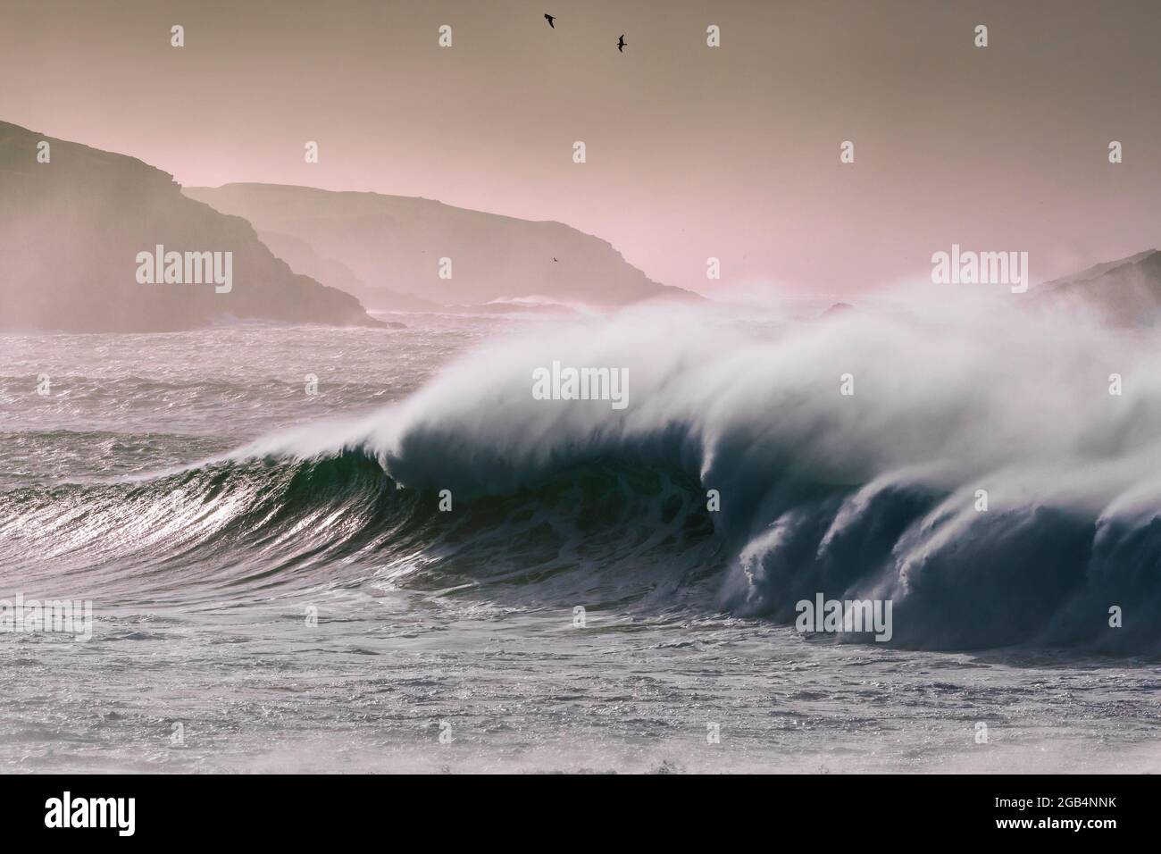 Spray blown off waves by strong offshore wind in Fistral Bay in Newquay ...