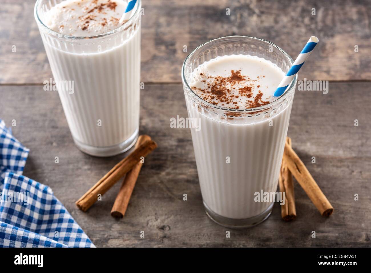 Fresh horchata with cinnamon in glass on rustic wooden table Stock ...