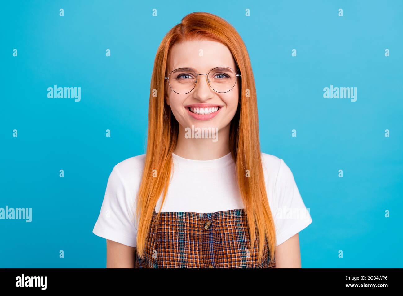 Photo of pretty charming orange hair lady wear plaid overall spectacles ...