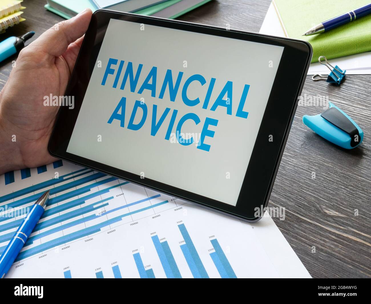 Man reads financial advice on the tablet Stock Photo - Alamy