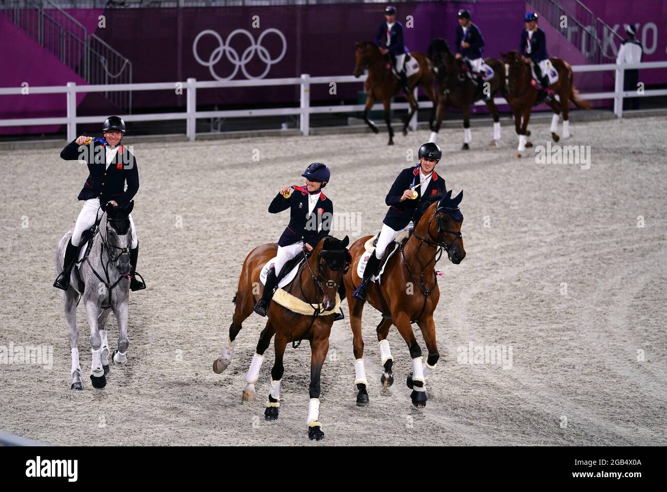 Great Britain's Laura Collett, Tom McEwen and Oliver Townend with their ...