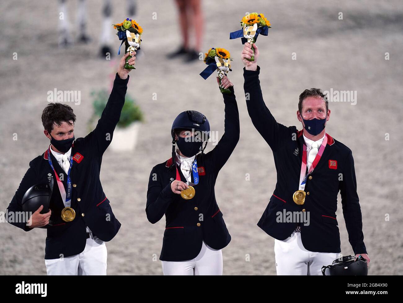 Great Britain's Laura Collett, Tom McEwen and Oliver Townend with their ...