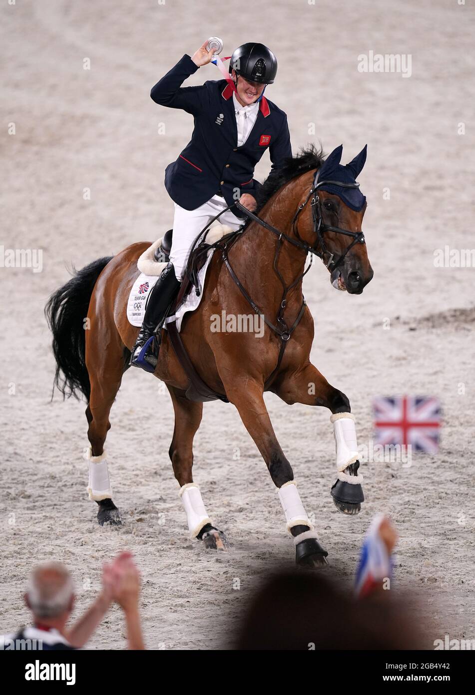 Great Britain's Tom McEwen with his Silver medal after riding Toledo de ...