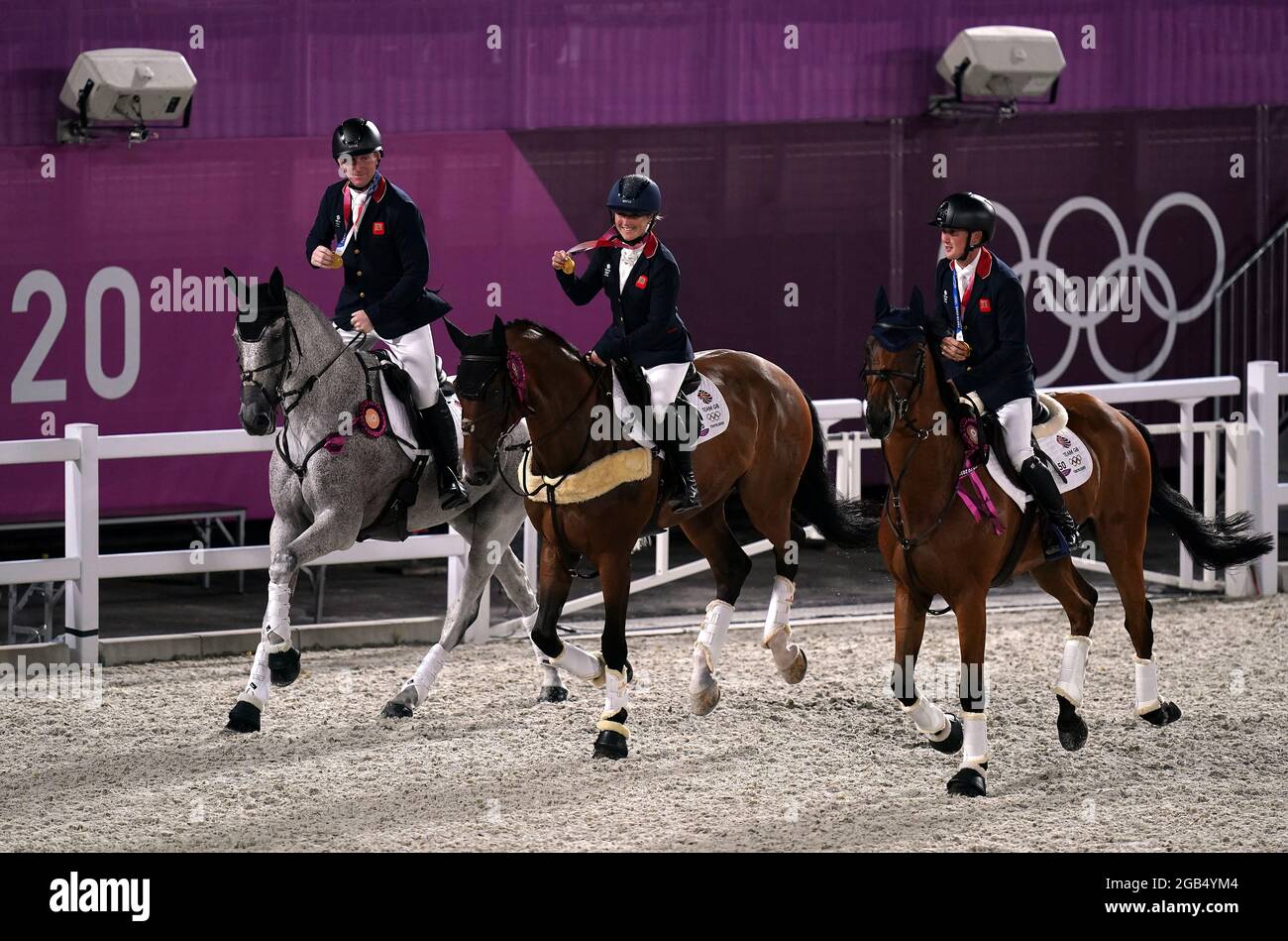 Great Britain's Laura Collett, Tom McEwen and Oliver Townend with their ...