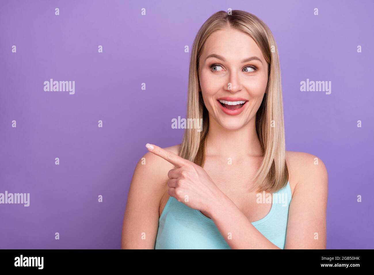 Photo portrait smiling blonde woman cheerful showing copyspace isolated ...