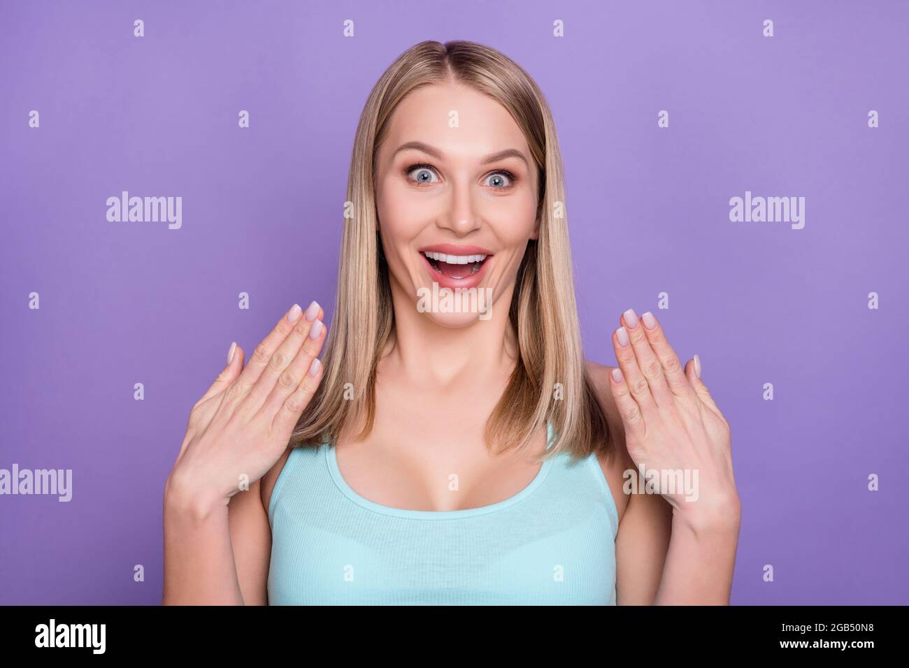 Photo of hooray blond millennial lady open mouth wear blue top isolated ...