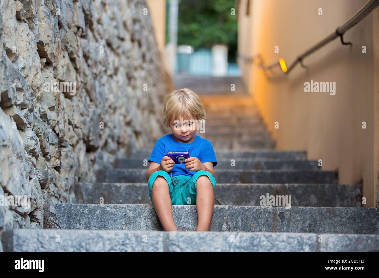 Happy beautiful children, boys, playing on stone staircasechild, kid ...