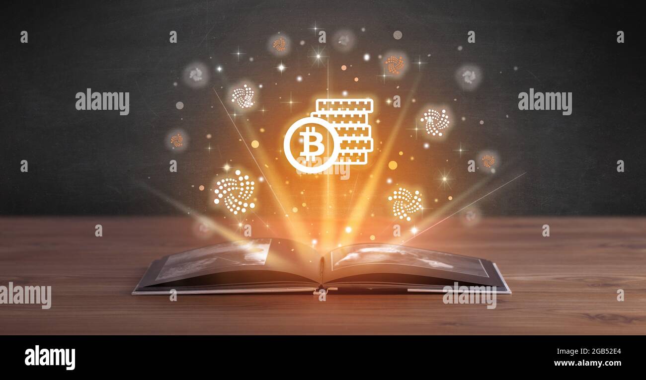 Open book with currency icons above Stock Photo - Alamy