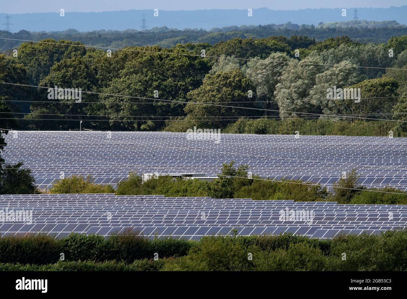 Solar energy panels in countryside setting in sunshine Stock Photo - Alamy