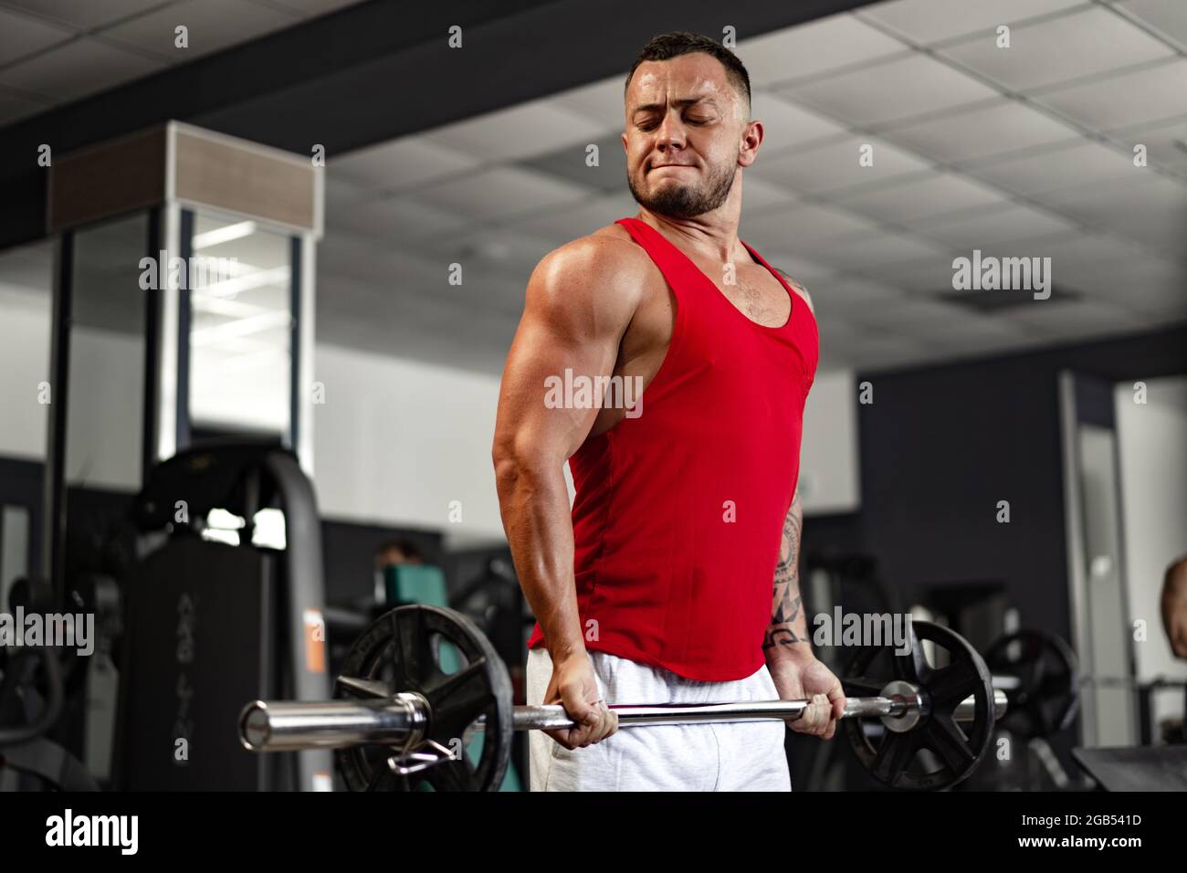 Strong man athlete exercise in gym, close up portrait Stock Photo - Alamy