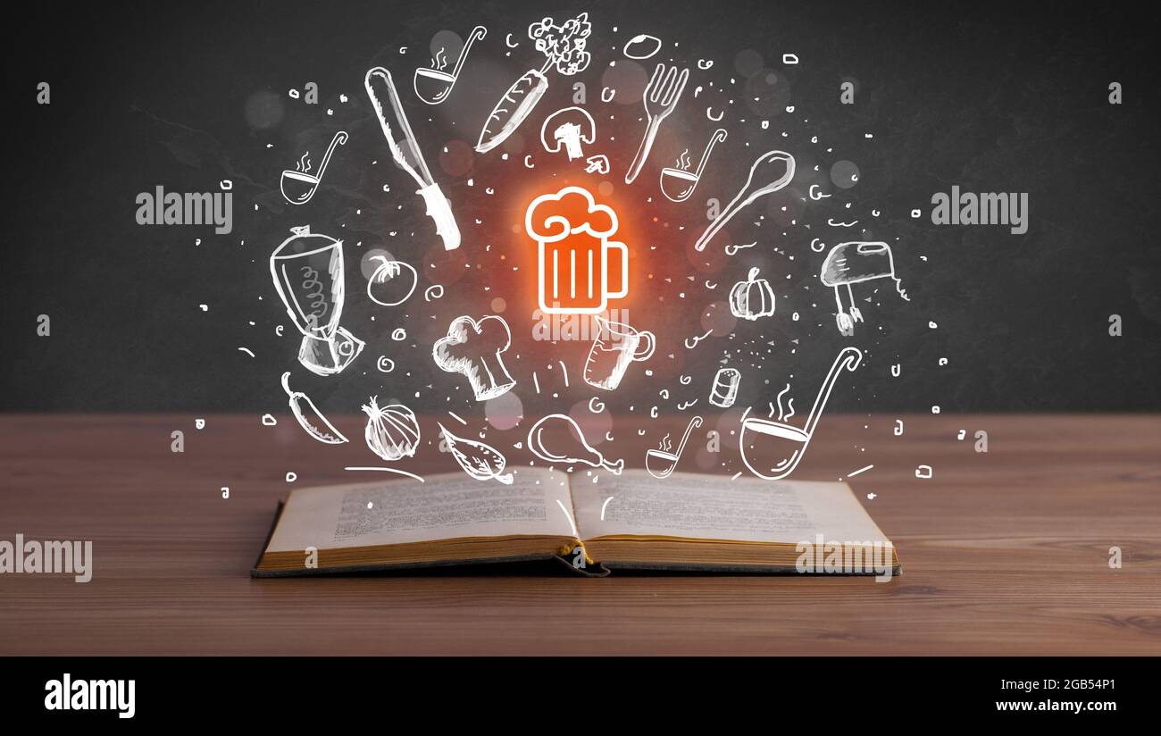 Open recipe book with food related icons above Stock Photo - Alamy