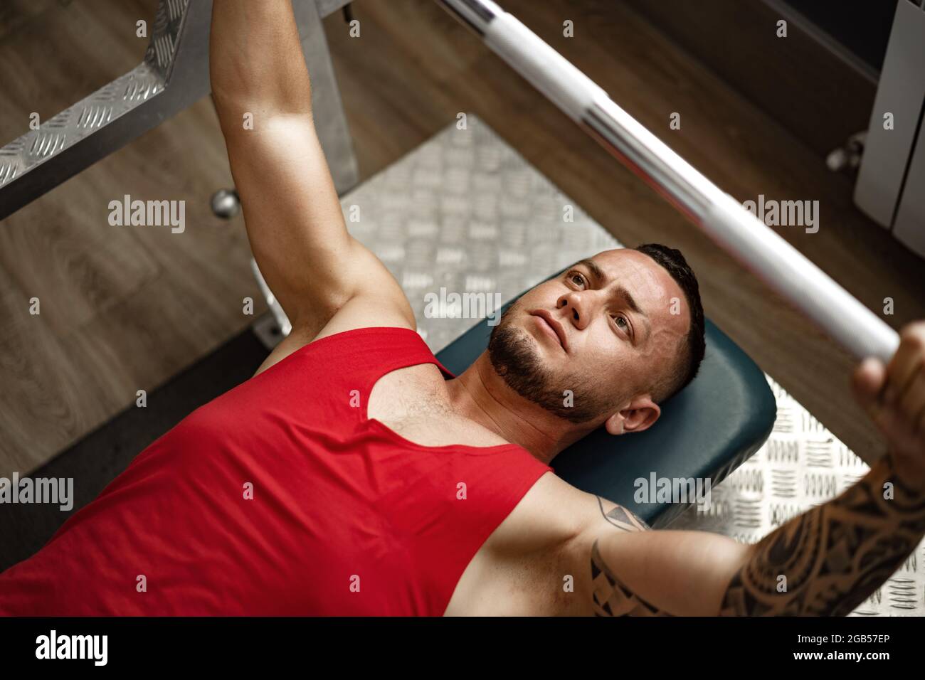 Strong man athlete exercise in gym, close up portrait Stock Photo - Alamy