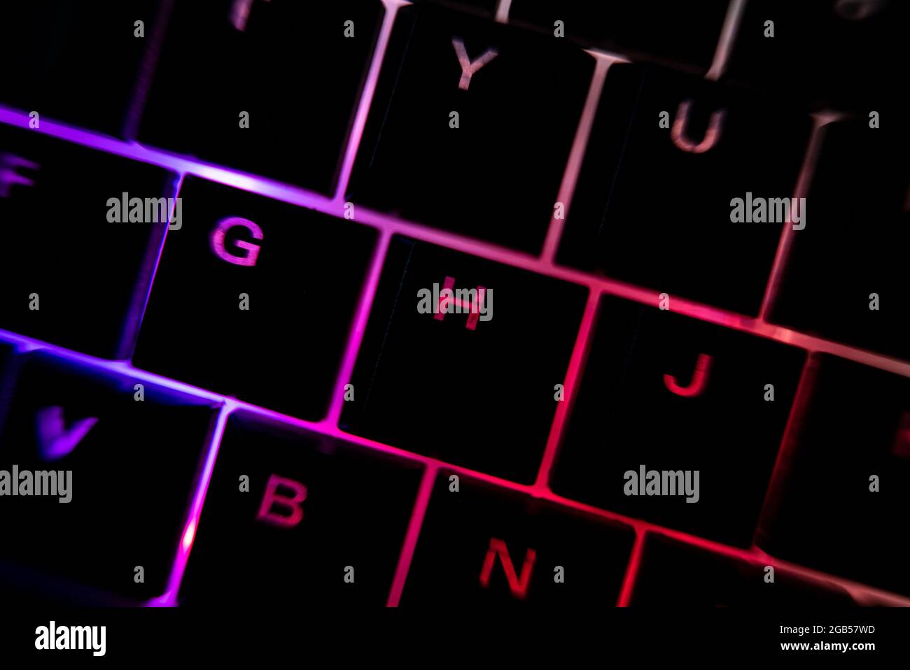 Backlit keyboard detail illuminated in the dark Stock Photo - Alamy