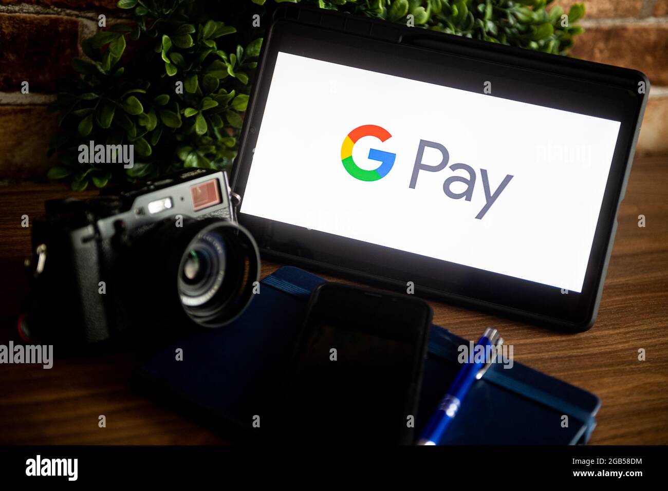 In this photo illustration a Google Pay logo seen displayed on a tablet ...