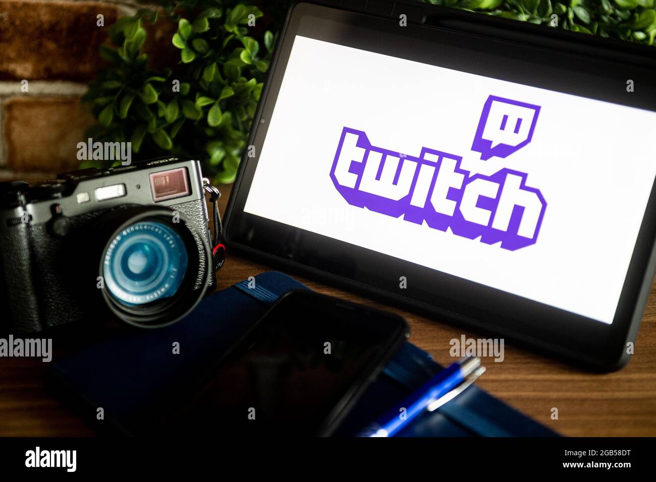 In this photo illustration a Twitch logo seen displayed on a tablet ...