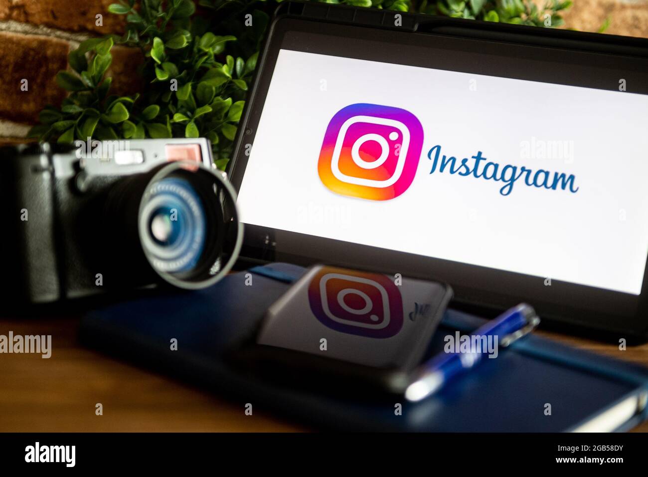 In this photo illustration, an Instagram logo seen displayed on a ...