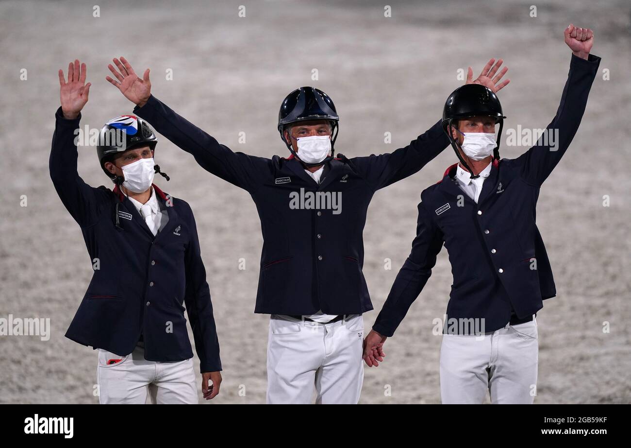 France wait to receive their bronze medals from the Equestrian Jumping ...
