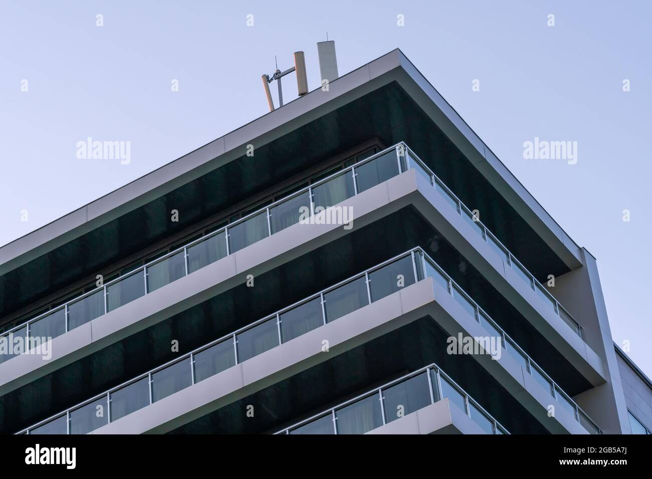 Modern building with installed antennas for mobile phones close-up ...