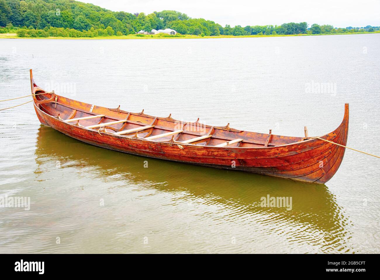 Small Viking boat karve by the river shore Stock Photo - Alamy