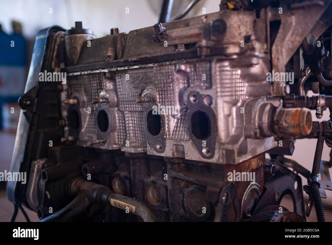Detail of old and rusty car engine in a workshop Stock Photo - Alamy