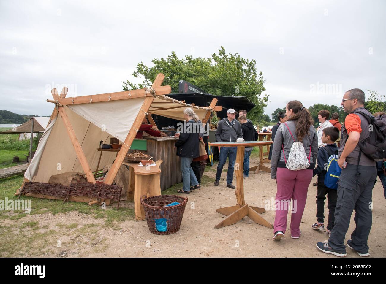 Real life actors act as villagers dressed in middle age viking attires ...