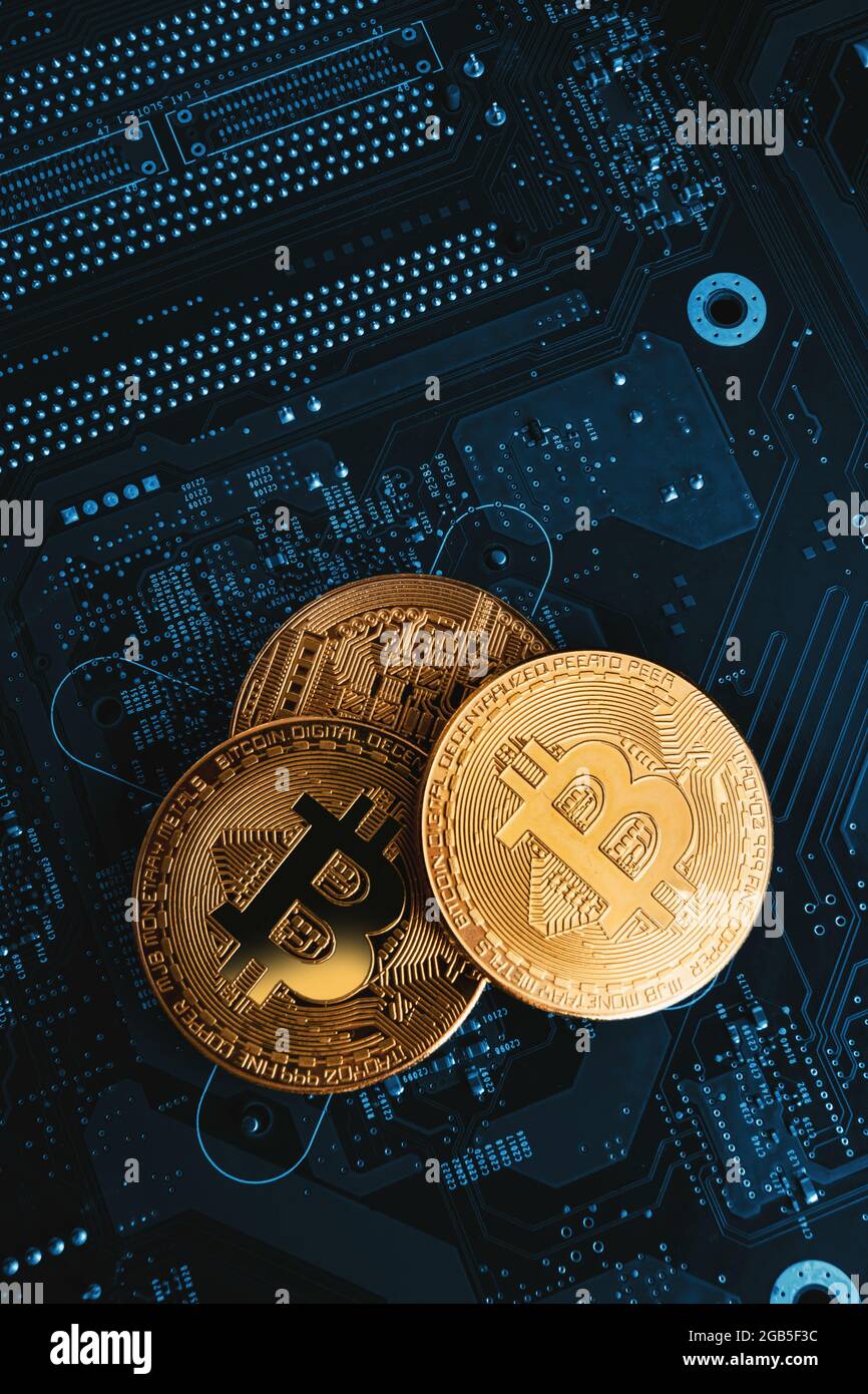 Bit coins on the background of a computer microcircuit Stock Photo - Alamy