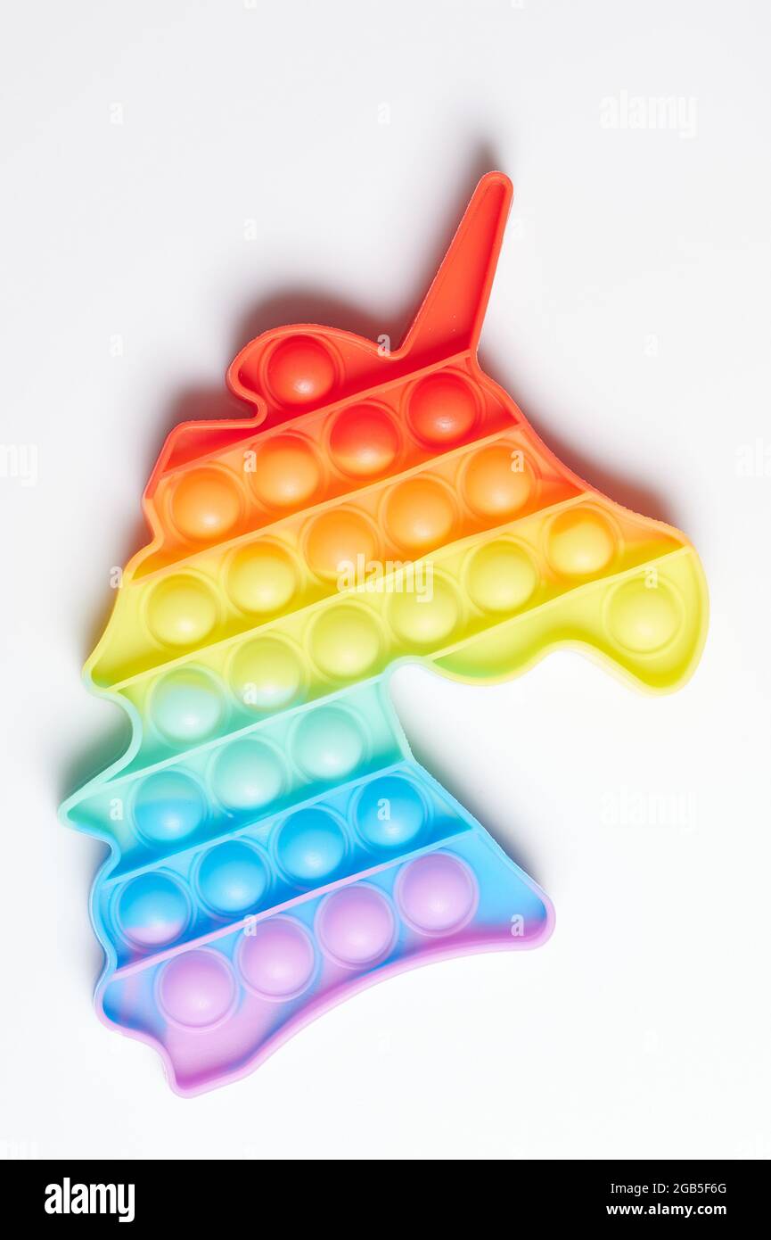 Unicorn shape popit silicone colorful toy above top view isolated Stock ...
