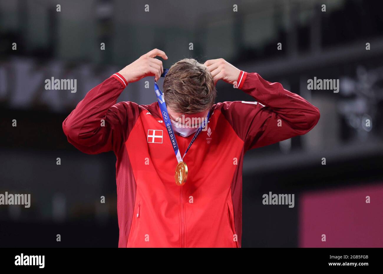 Tokyo, Japan. 2nd Aug, 2021. Viktor Axelsen of Denmark puts on his gold ...