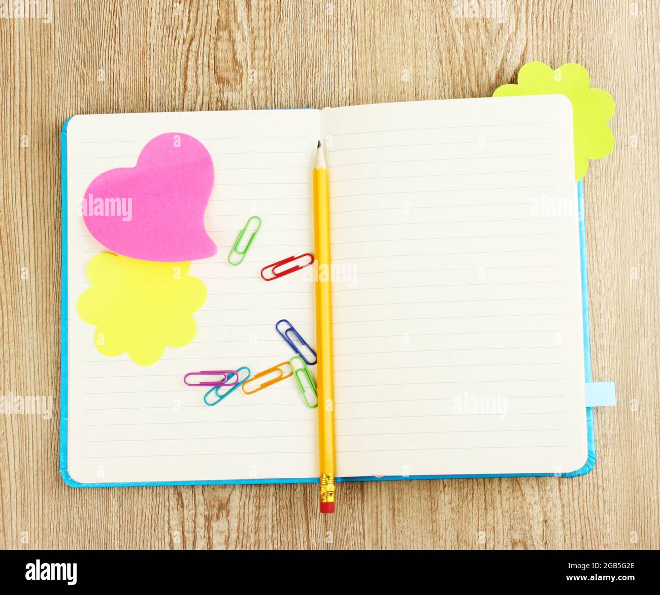 Open note book with stickies and pencil on wooden background Stock ...