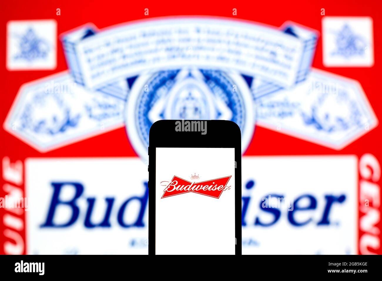 In this photo illustration a Budweiser logo seen displayed on a ...