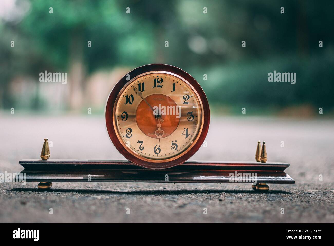 SAMARKAND, UZBEKISTAN - Feb 02, 2017: A vintage wooden clock on the ...