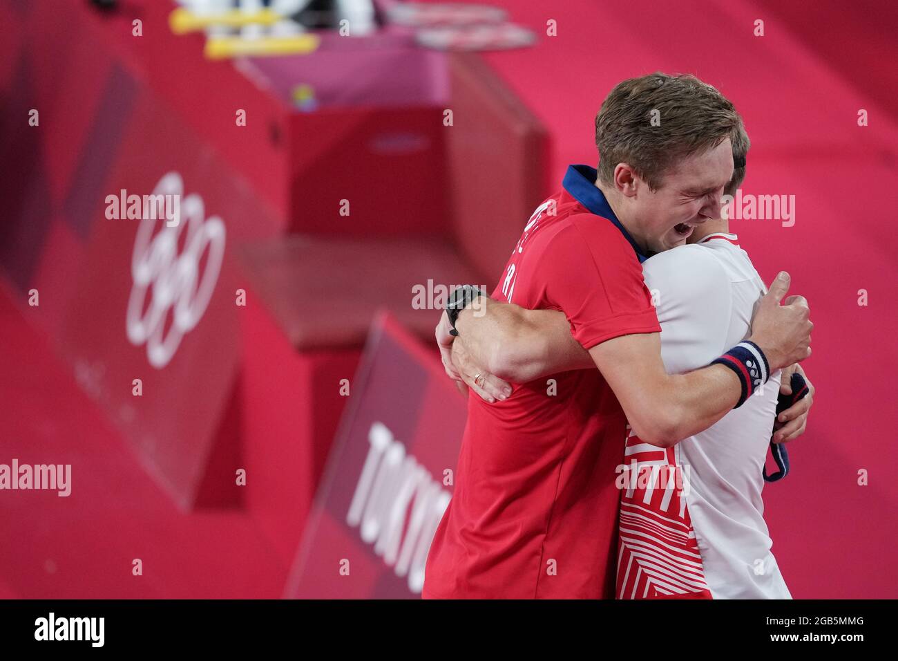 Tokyo, Japan. 2nd Aug, 2021. Viktor Axelsen (L) of Denmark celebrates ...