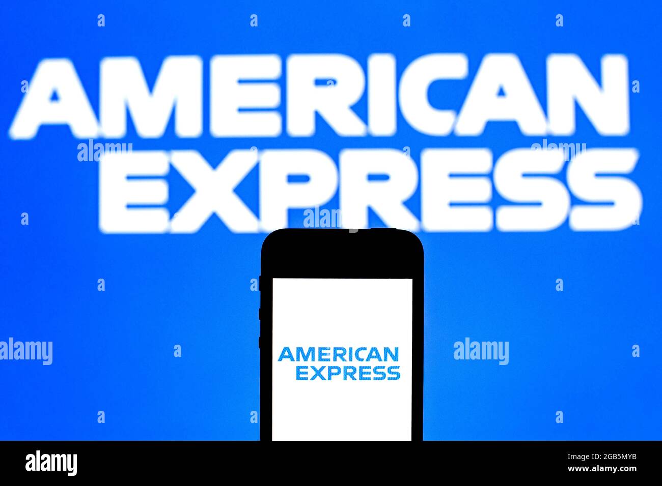 In this photo illustration an American Express logo seen displayed on a ...
