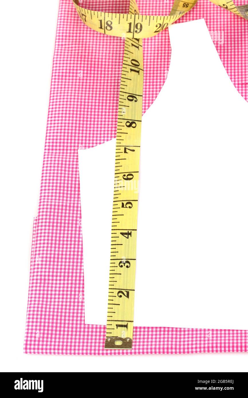 Measuring tape and pattern on fabric isolated on white Stock Photo - Alamy