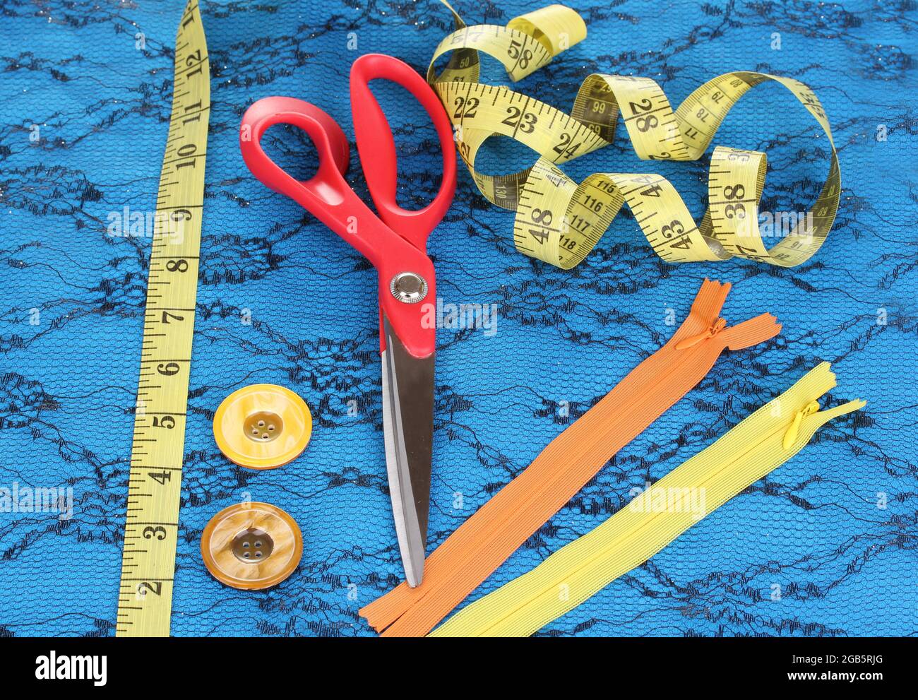 Sewing accessories on fabric Stock Photo - Alamy