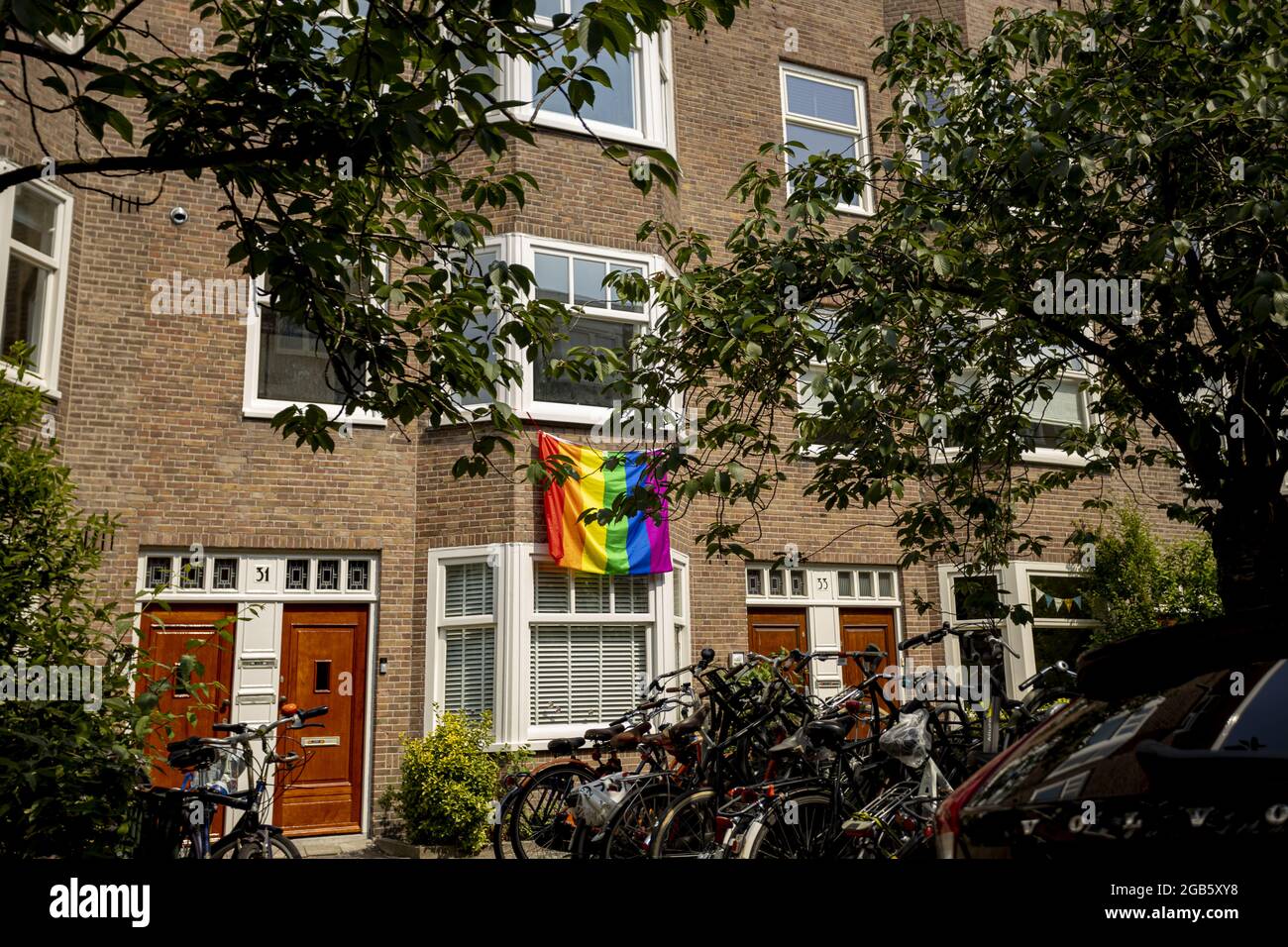 AMSTERDAM, NETHERLANDS - Jun 26, 2021: Lgbtq rainbow flag hanging on an ...