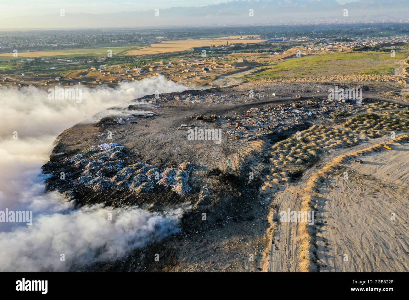 Aerial view of burning garbage pile in trash dump or landfill Stock ...