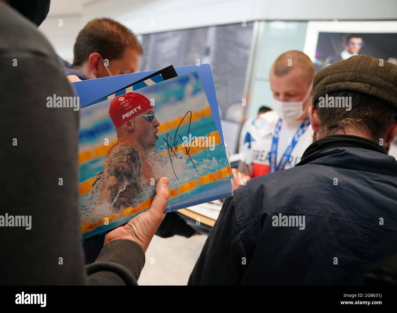 British swimmer Adam Peaty arrives back at London Heathrow Airport from ...